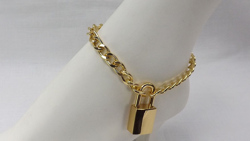 Locking anklet with small gold color padlock and gold color chain ...